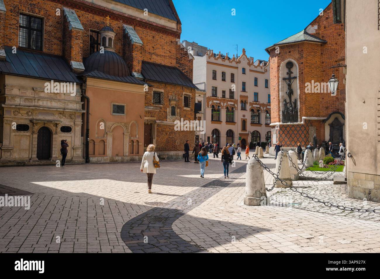 Historic Poland, view of people walking between scenic medieval and ...