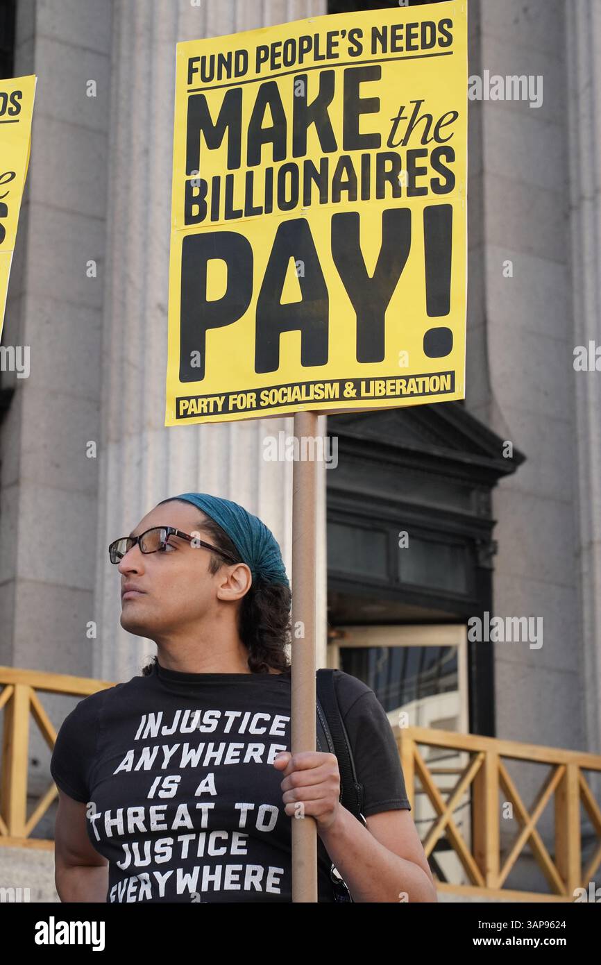New York, United States. 14th Apr, 2025. A protestor holds a placard ...