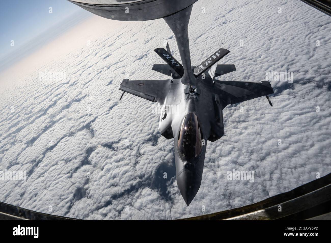 A Royal Danish Air Force F-35 Lightning II receives fuel from a U.S ...
