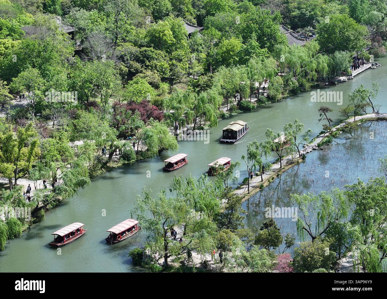 Aerial photo shows tourists visiting the Slender West Lake scenic area ...