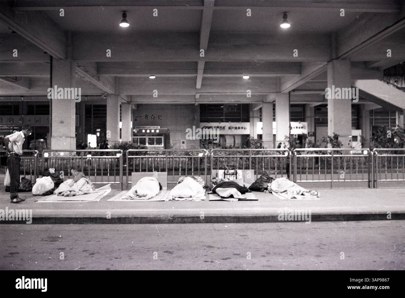 People Sleeping Outdoors at Urban Transit Hub - Night Shelter Scene ...