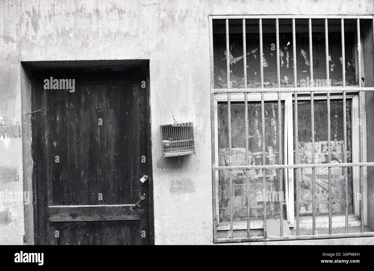 Old Residential Door and Barred Window with Birdcage - Urban Edge ...
