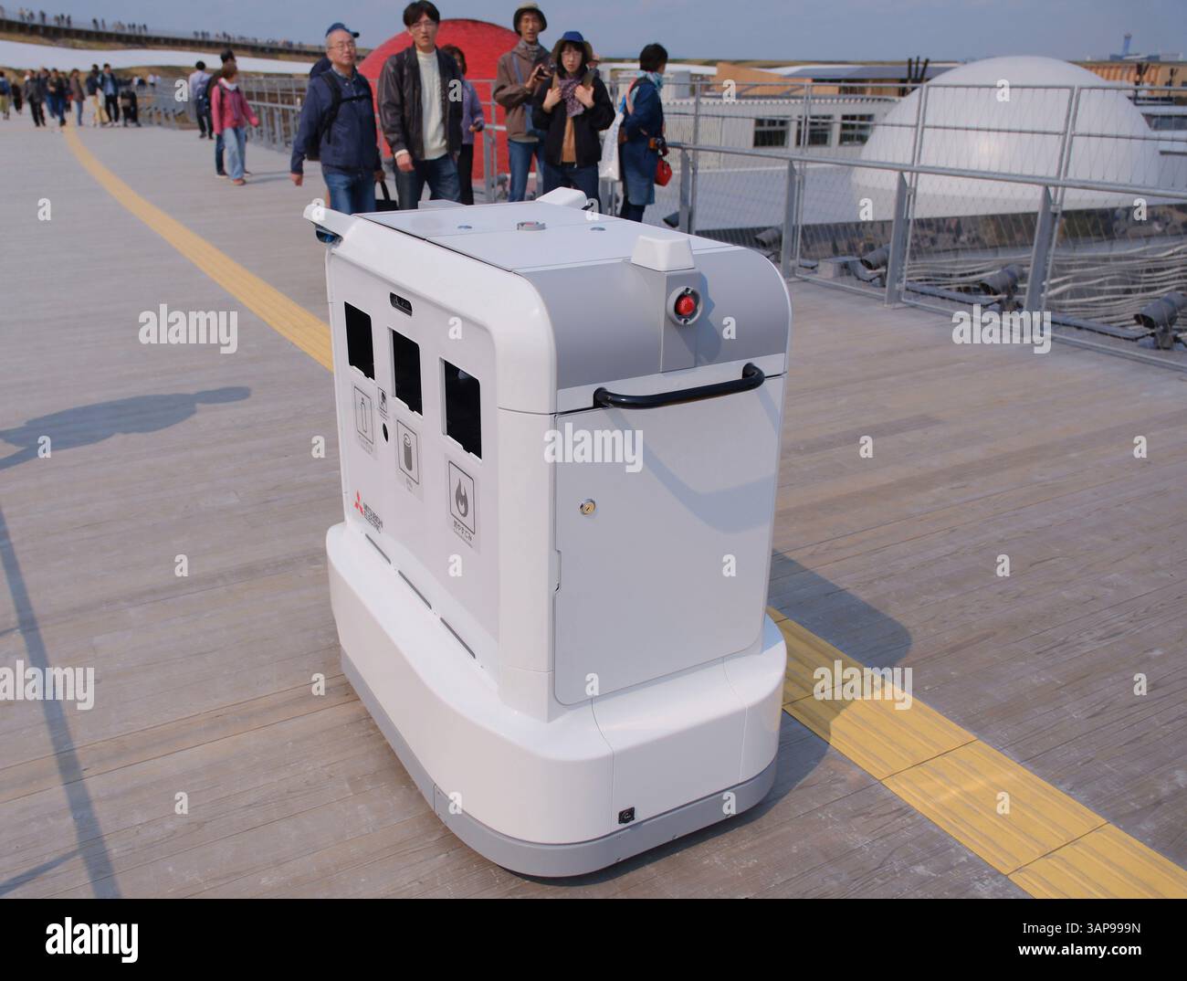 An autonomous mobile garbage can robot produced by Mitsubishi Electric ...