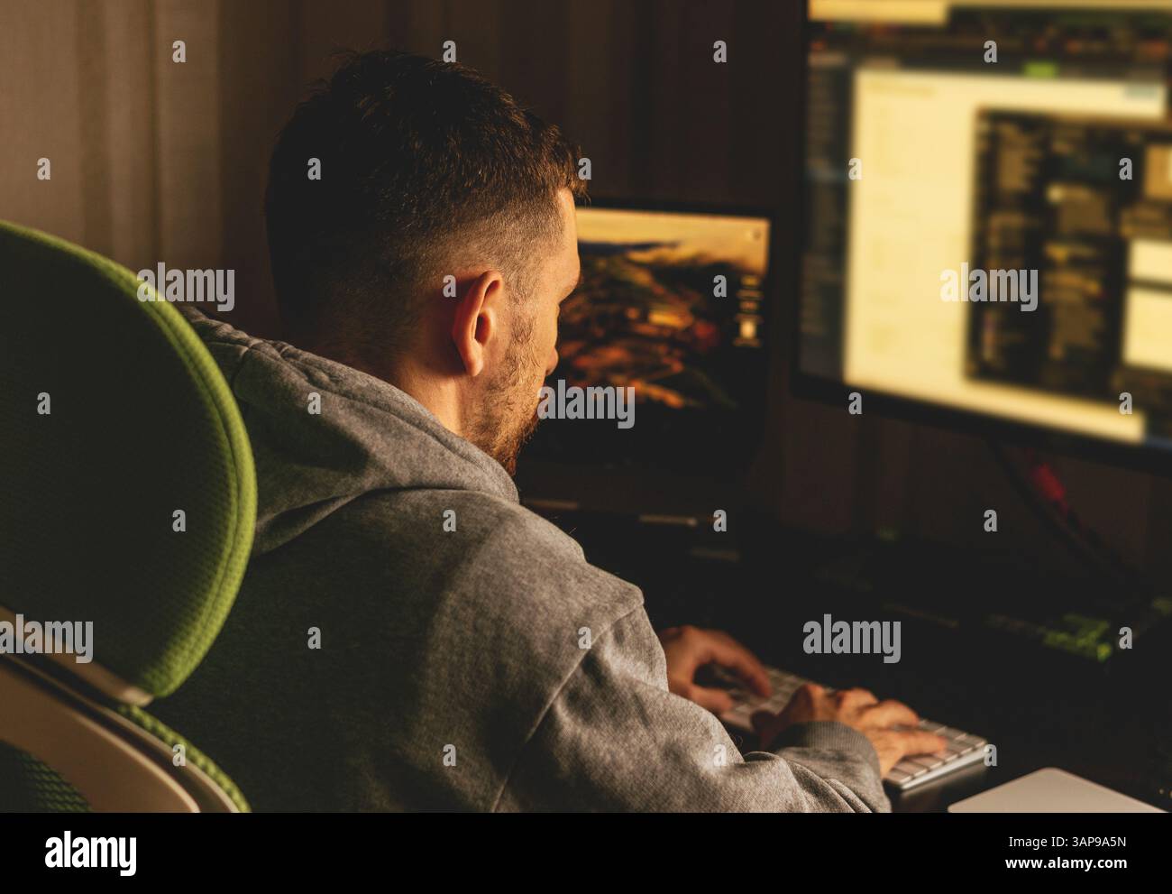 The guy is watching the game on stream Stock Photo - Alamy
