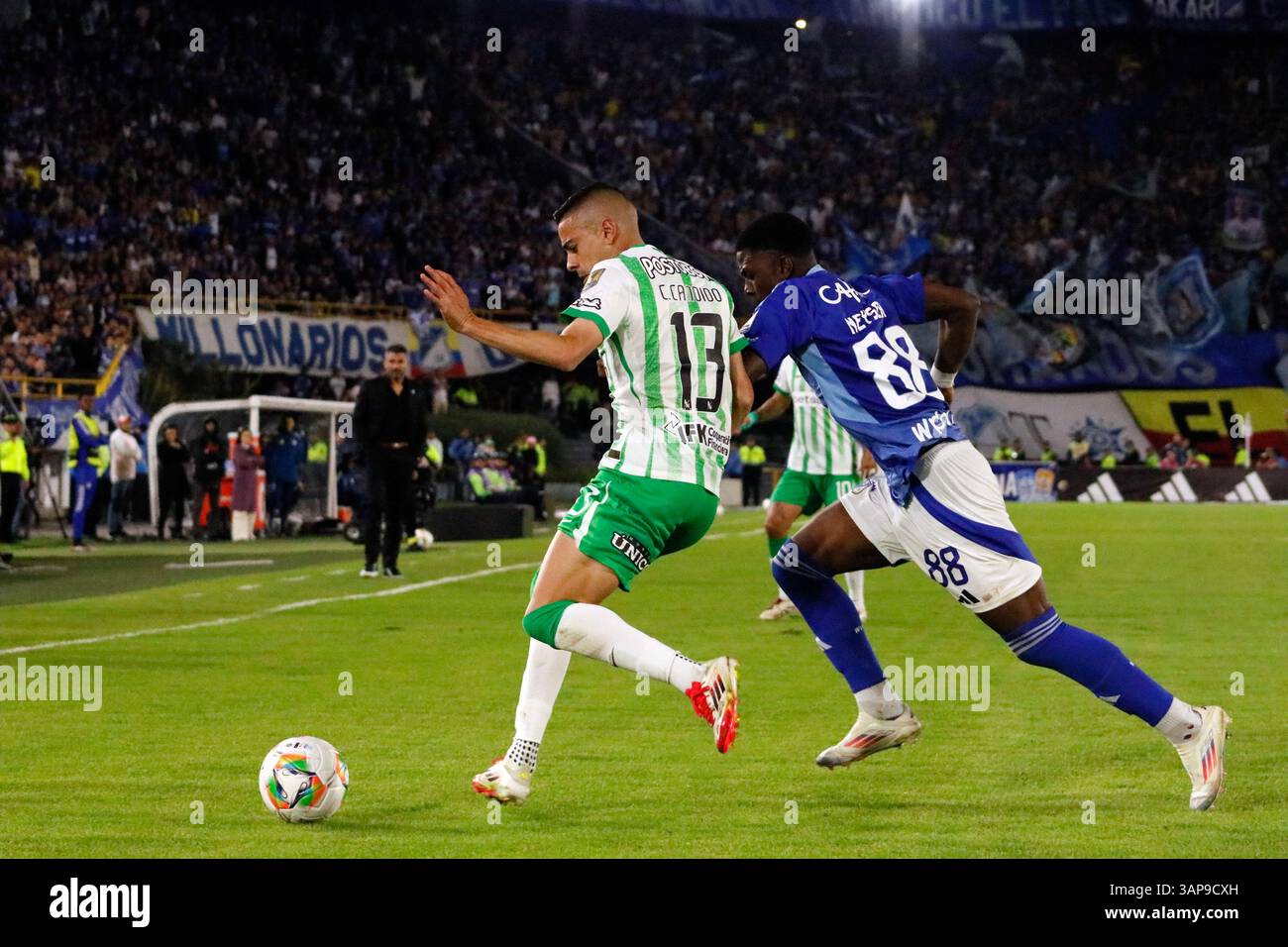 Atletico Nacional's Camilo Candido (L) fights the ball with Millonarios ...