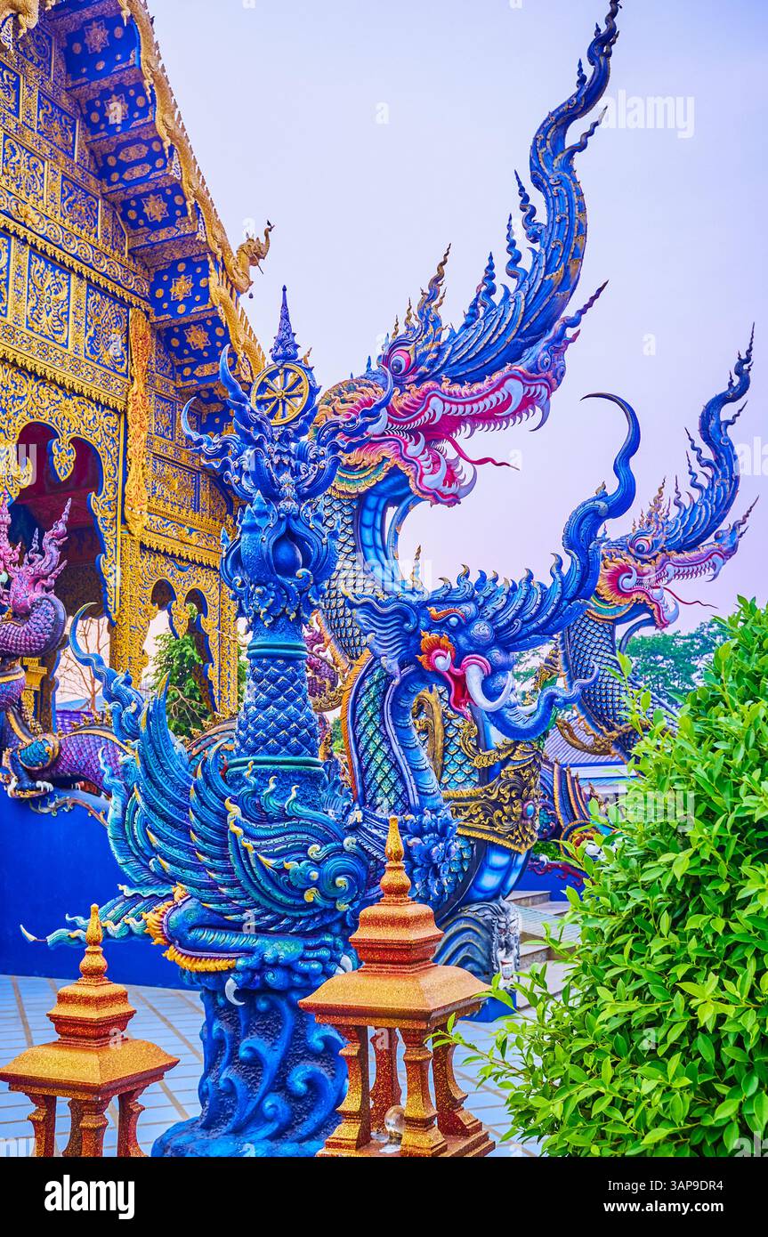 Two Naga serpents stand guard at the entrance of Wat Rong Suea Ten (the ...