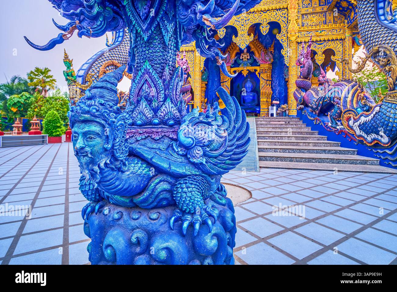 Blue ornate sculptures in the courtyard of Wat Rong Suea Ten (Blue ...