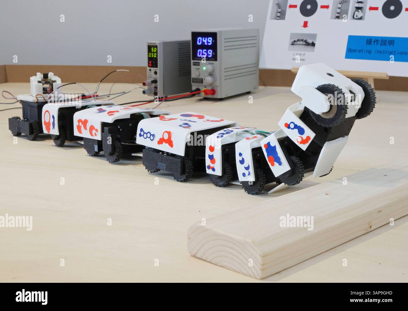 An earthworm-type pipe-traveling robot, Sooha, is demonstrated at the ...