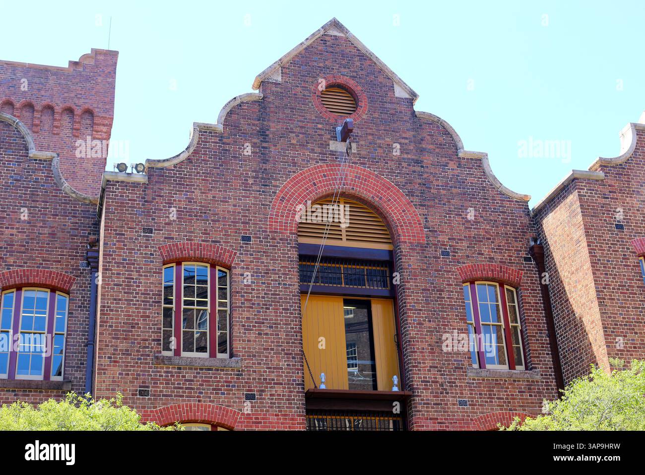 5098 Historic red brick warehouse with a cable winch attached to the ...