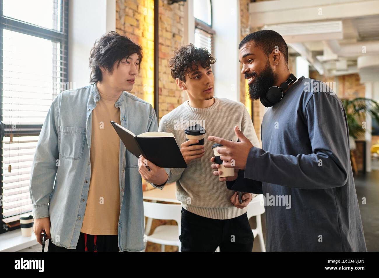 Three coworkers share ideas and insights while collaborating in a ...