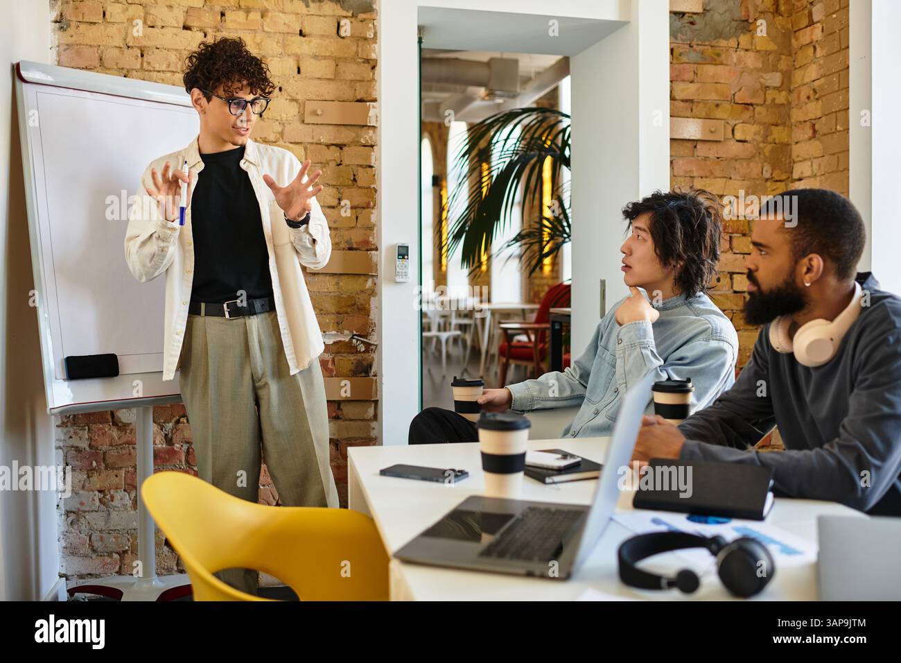 Colleagues engage in a lively discussion, exchanging ideas and insights ...