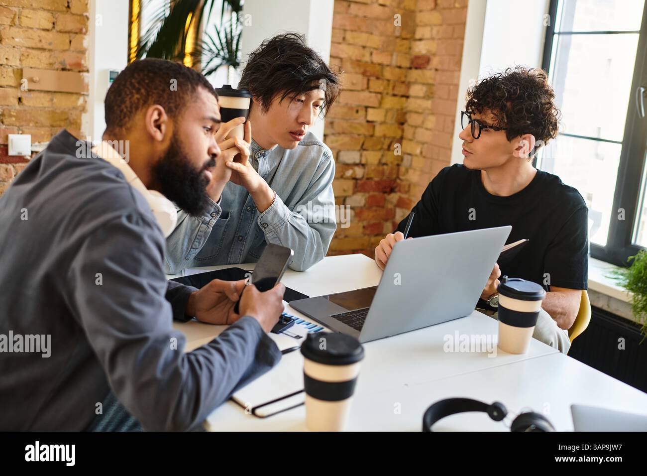 Three professionals collaborate energetically at a stylish workspace, sharing ideas and insights ...