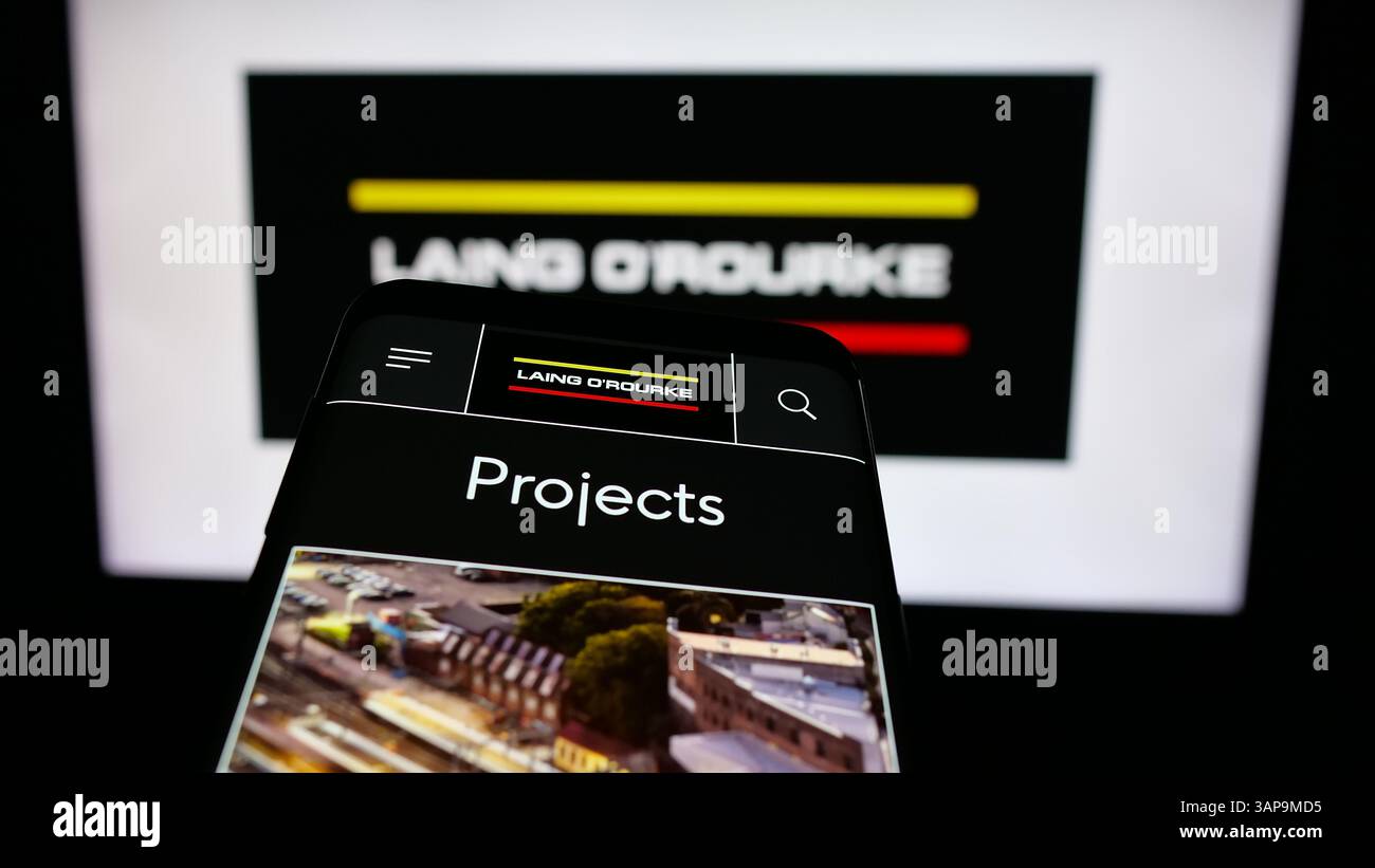 In this photo illustration, a mobile phone with the website of British construction company ...