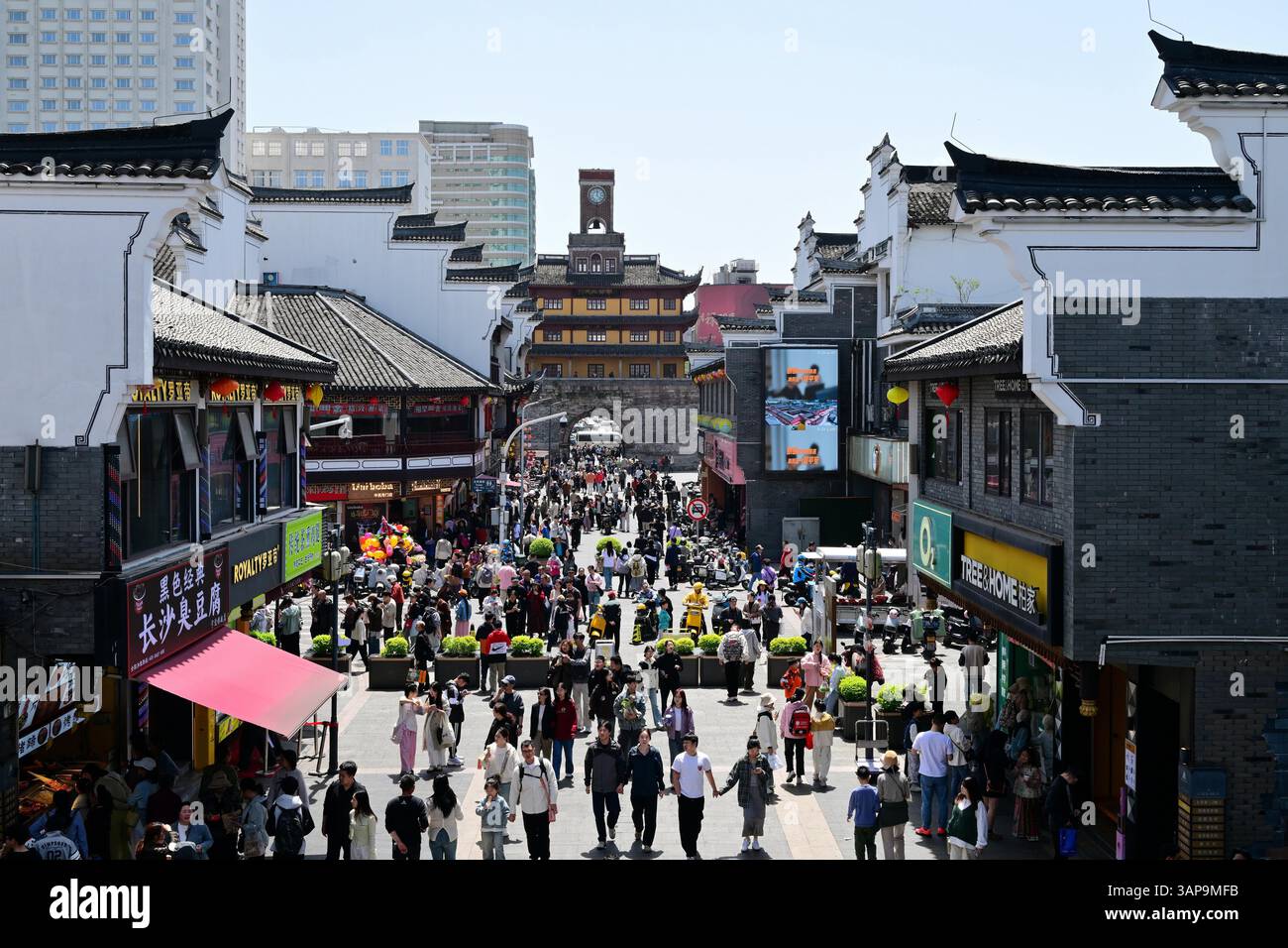 Tourists stroll on a walking street in Ningbo City, east China's ...