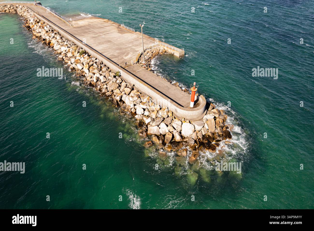 Maritime protection structure with lighthouse in a top-down perspective ...