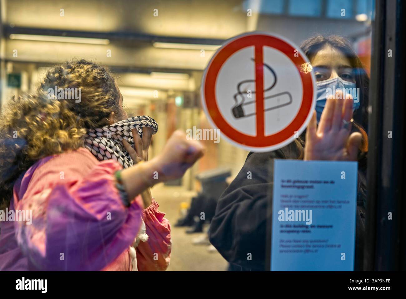Masked Pro-Palestine activists take part during the demonstration ...