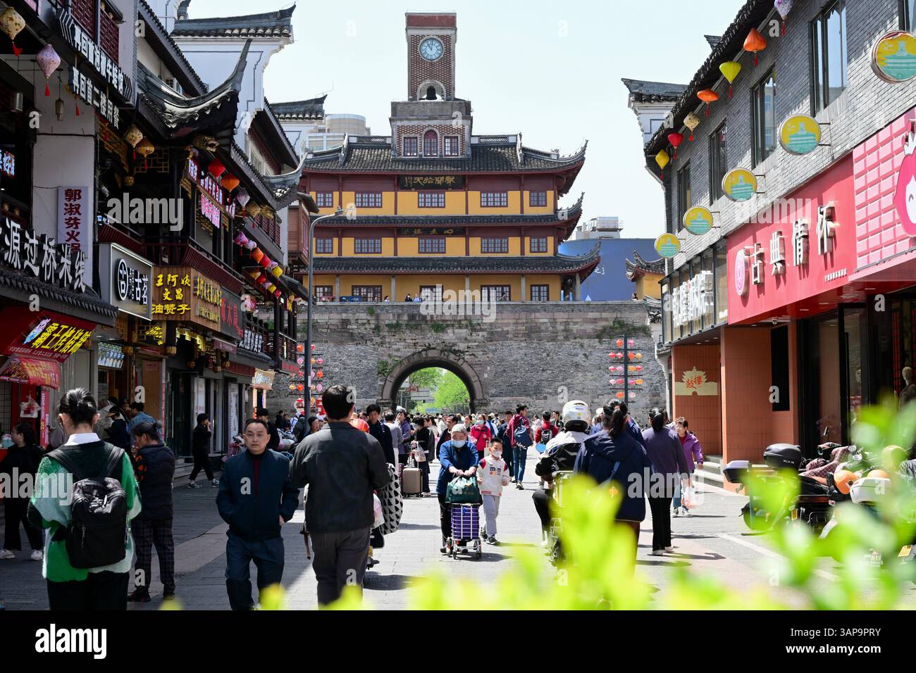 Tourists stroll on a walking street in Ningbo City, east China's ...