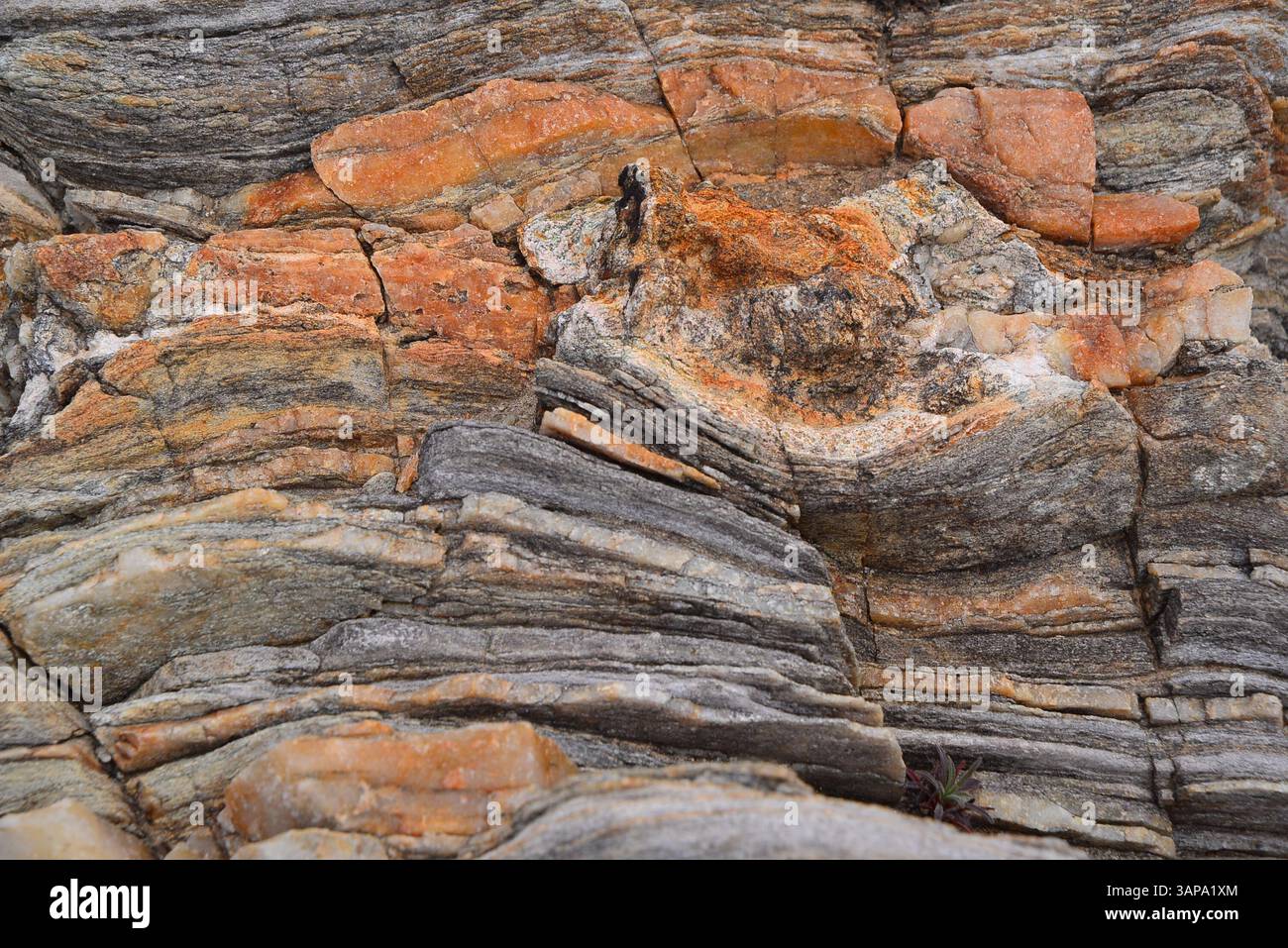 Stratified rock in different layers and materials Stock Photo - Alamy