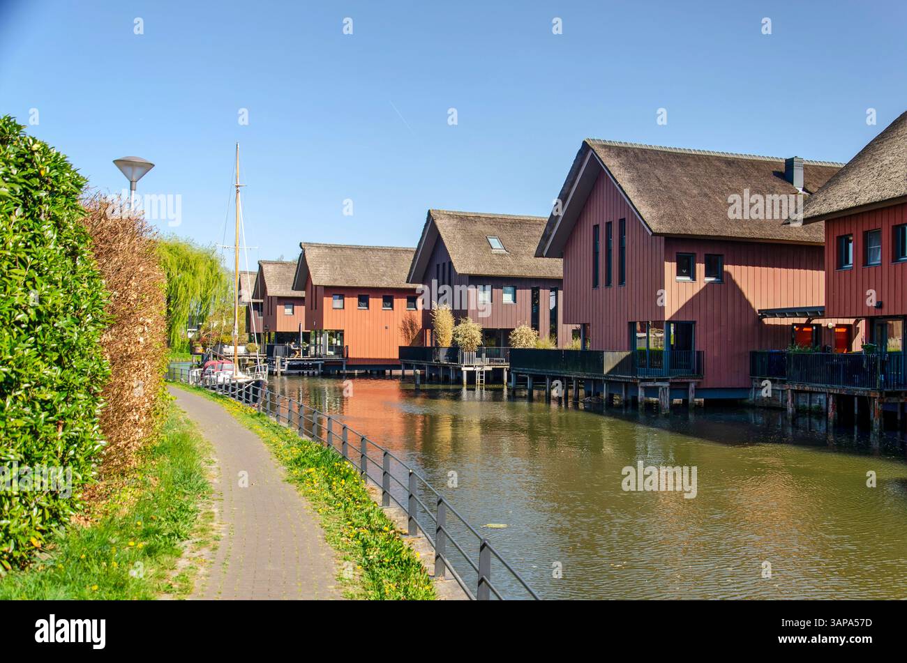 Harmelen, The Netherlands, April 12, 2025: path along a watercourse ...