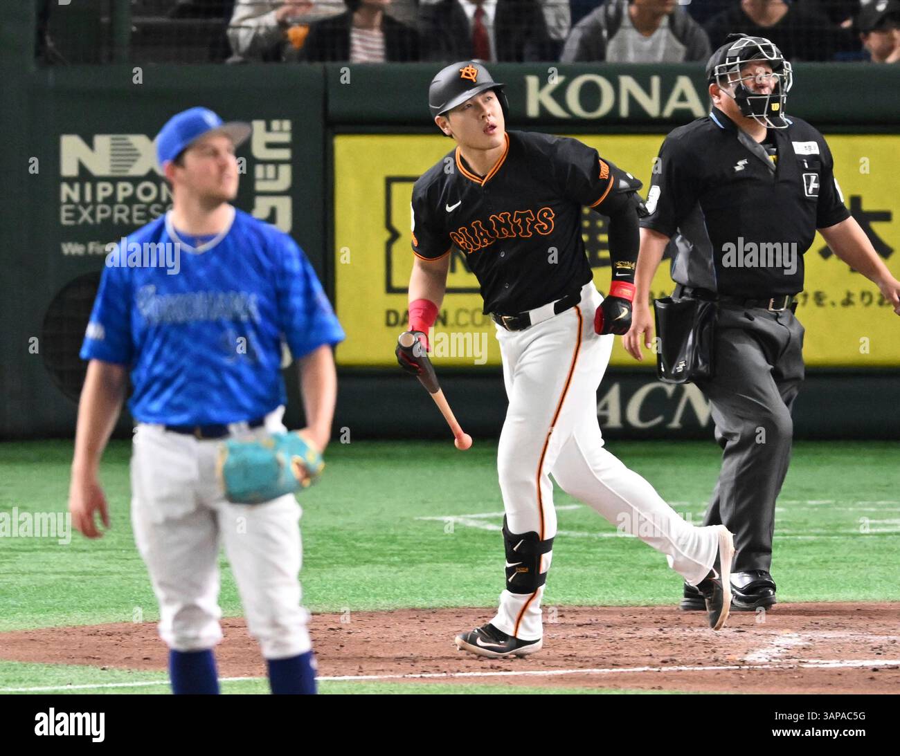 Yomiuri Giants infielder Kazuma Okamoto (C) hits a two-run home run in the fifth inning in an ...