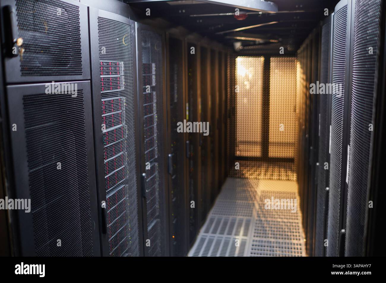 Modern server room featuring rows of black server racks and equipment creating a high-tech ...