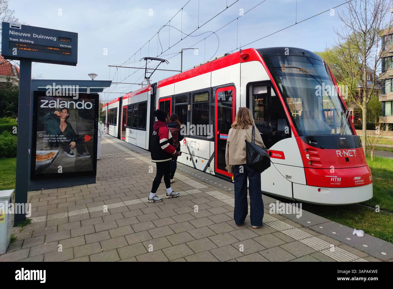 People board the tram from Scheveningen to The Hague, Netherlands Stock ...