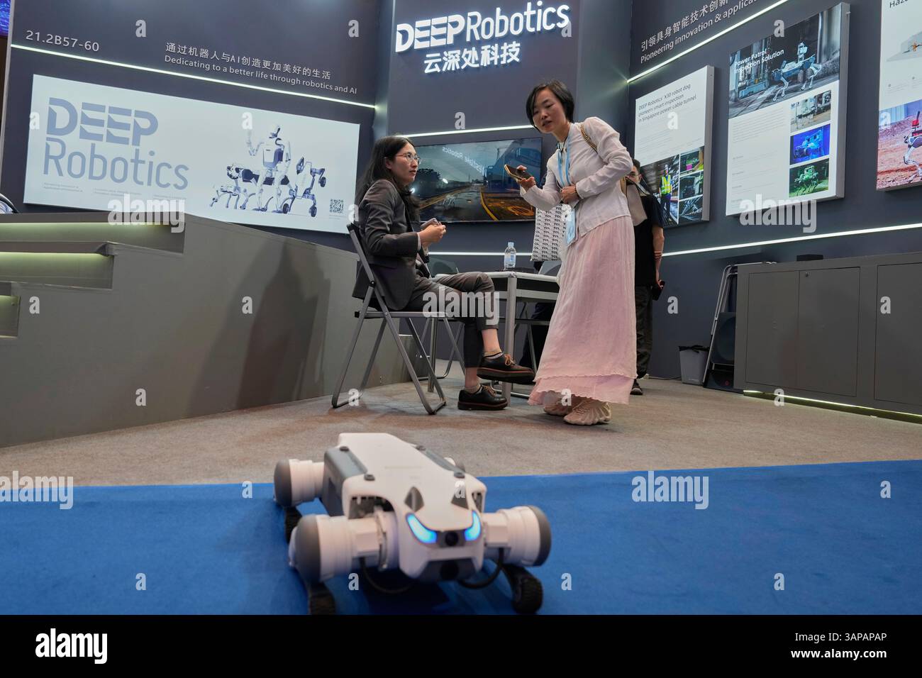 A visitor enquires about a robot from DeepRobotics at the 137th Canton ...