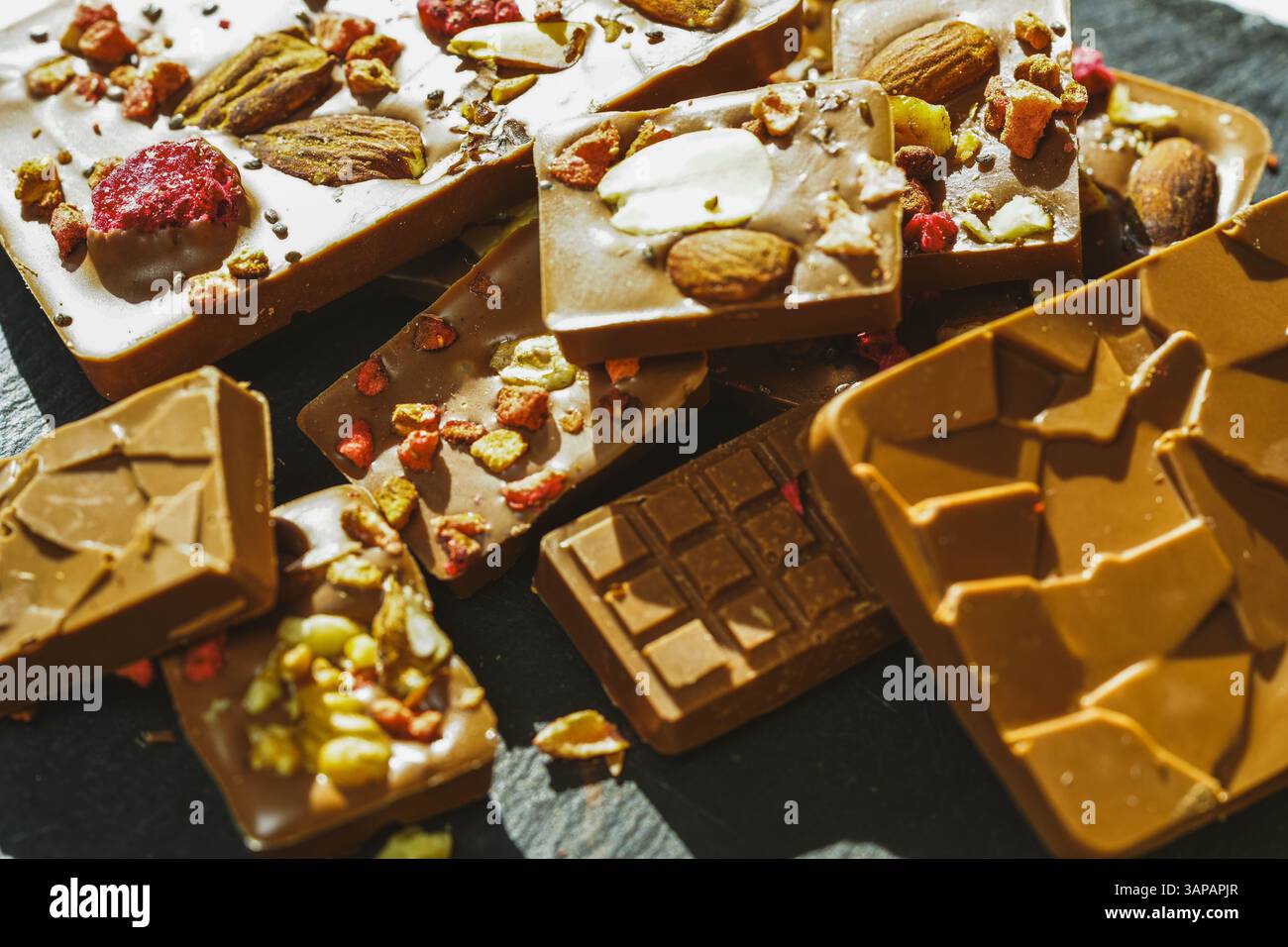Handmade chocolate close-up. Assorted chocolate with almonds, freeze ...