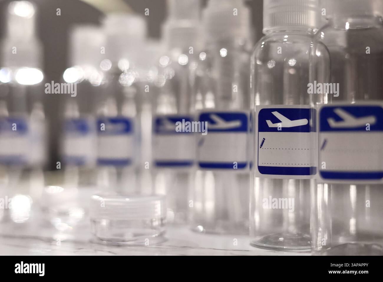 Small, transparent, plastic liquid bottles for plane traveling. Blank ...