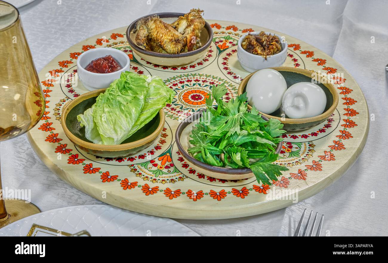 Bright Passover table set with traditional matzah and a beautifully ...