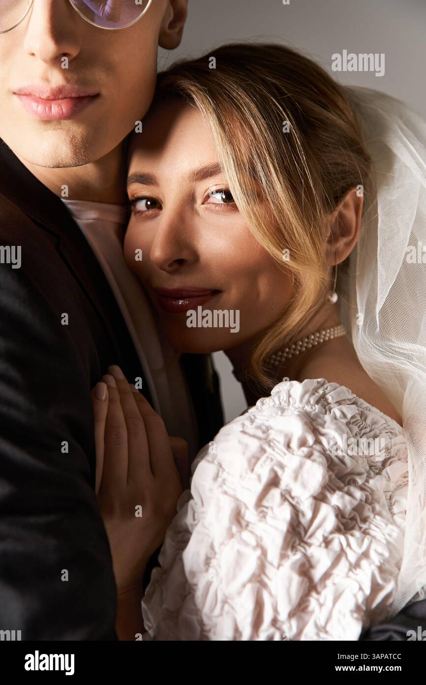 A delighted couple shares a tender moment, dressed elegantly for their ...