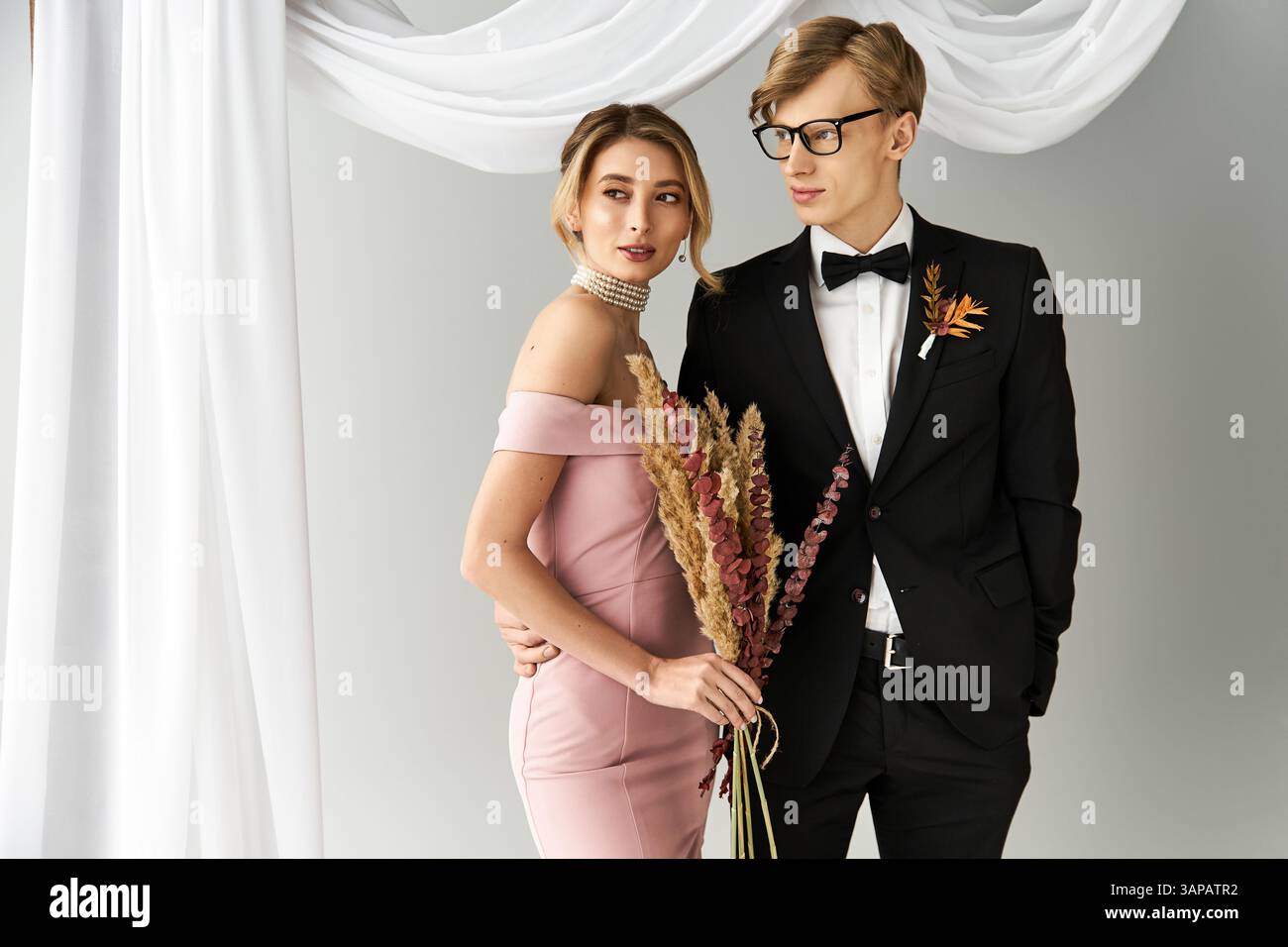 A young couple embraces in springtime, showcasing love and joy with ...