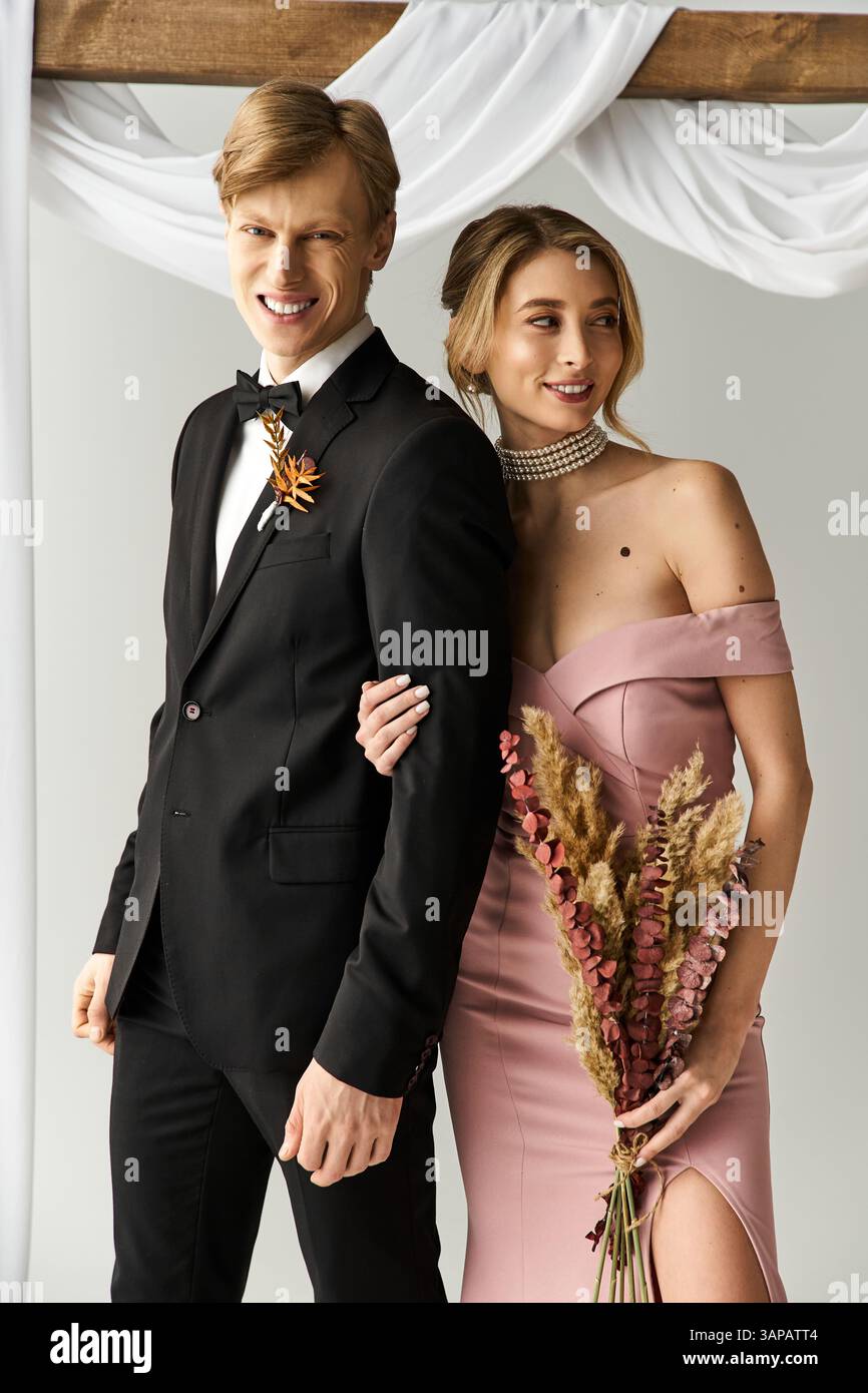 A joyful couple stands together, ready to embrace their special day in springtime romance Stock ...