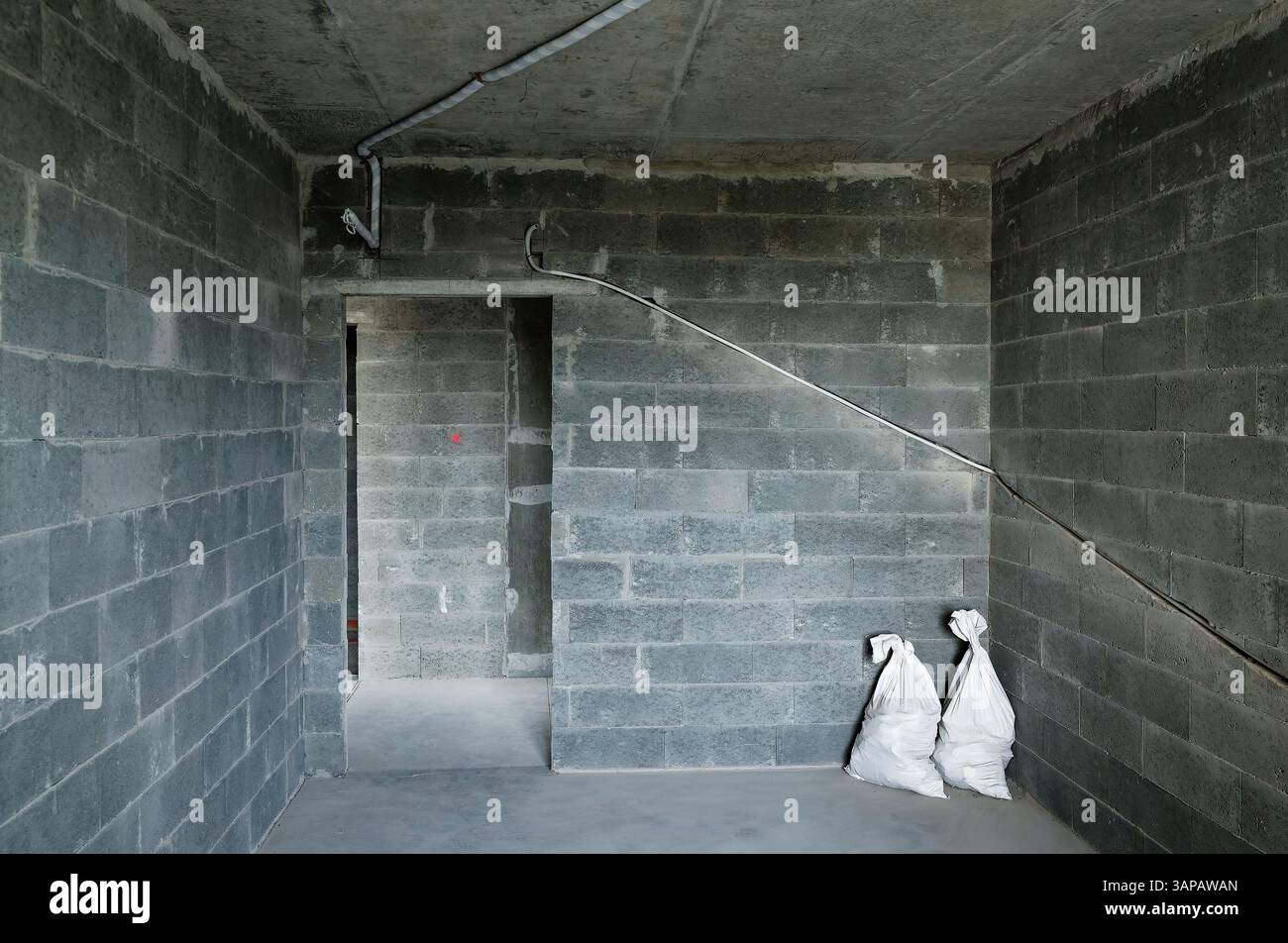 The doorway in the apartment is under renovation. The communications ...