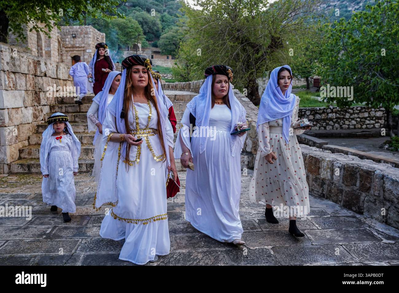 Lalish, Iraq. 15th Apr, 2025. Iraqi Yazidi women wear traditional ...