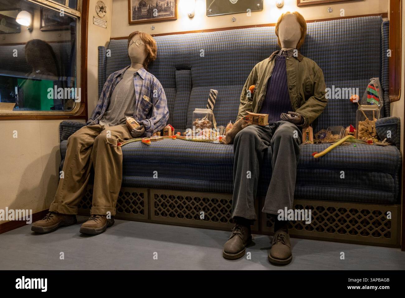 Models of Harry Potter and Ron Weasley in the train carriage, at Harry Potter World, Warner ...