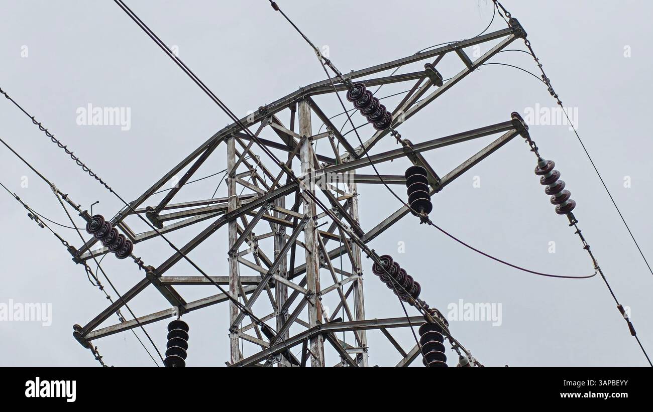 High voltage power line tower structure with insulators. Steel lattice ...