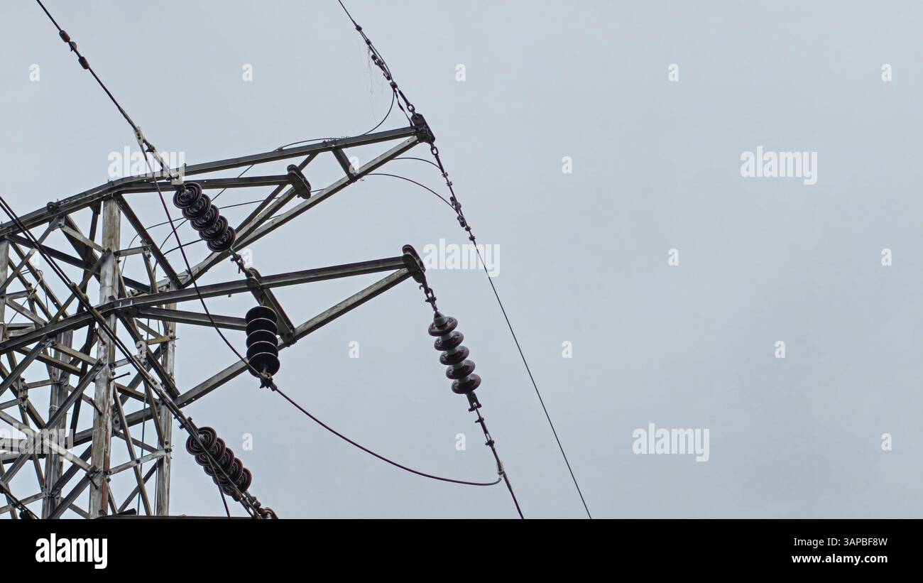 High voltage power line tower structure with insulators. Steel lattice ...