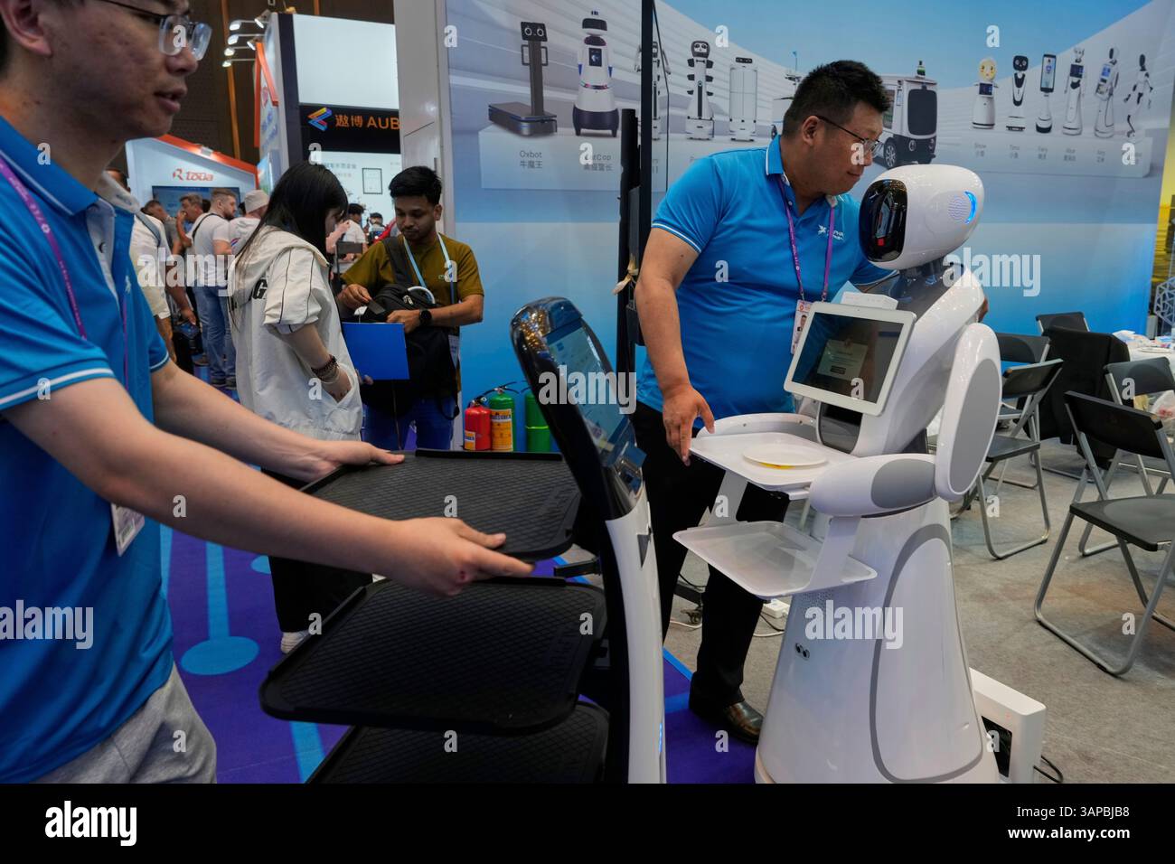 Vendors from AlphaRobotics.AI show off service robots at the 137th ...