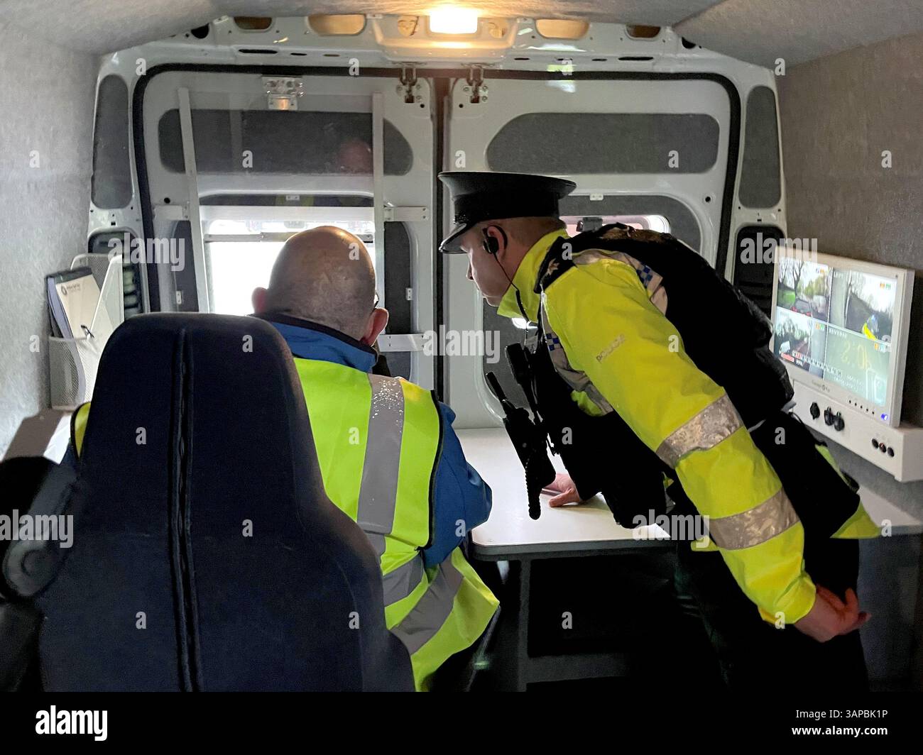 A view of Police Service Northern Ireland (PSNI) officers inside a road ...