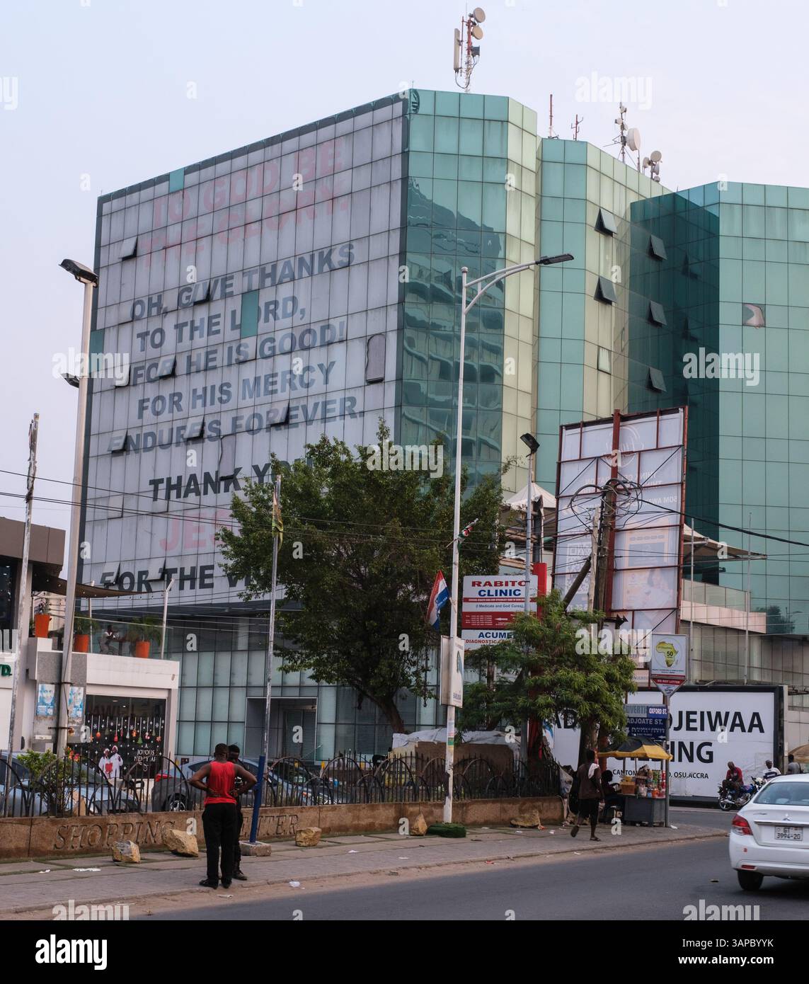 Accra, Ghana. Oxford Street Scene. Religious Slogan on Side of Modern ...