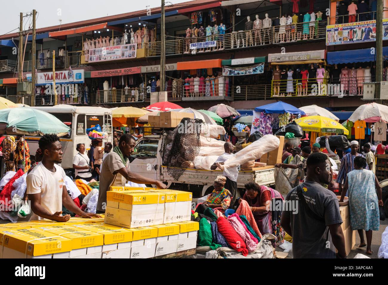 Accra, Ghana. Makole Market Street Scene. Mannequins Display Clothing in front of Upper Floor ...