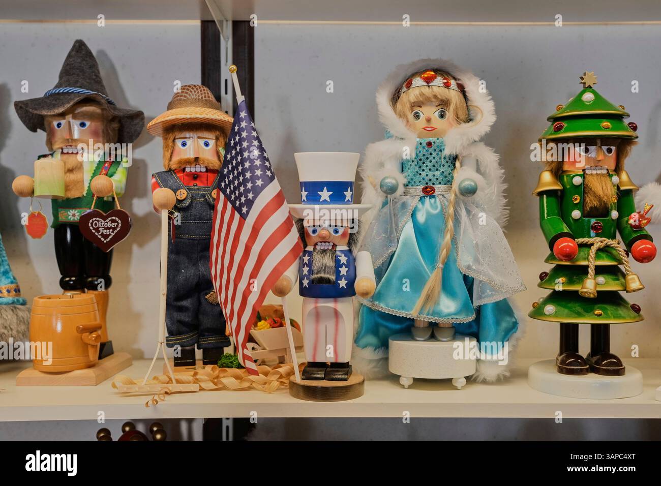 An Uncle Sam nutcracker with an American flag, center, stands between ...