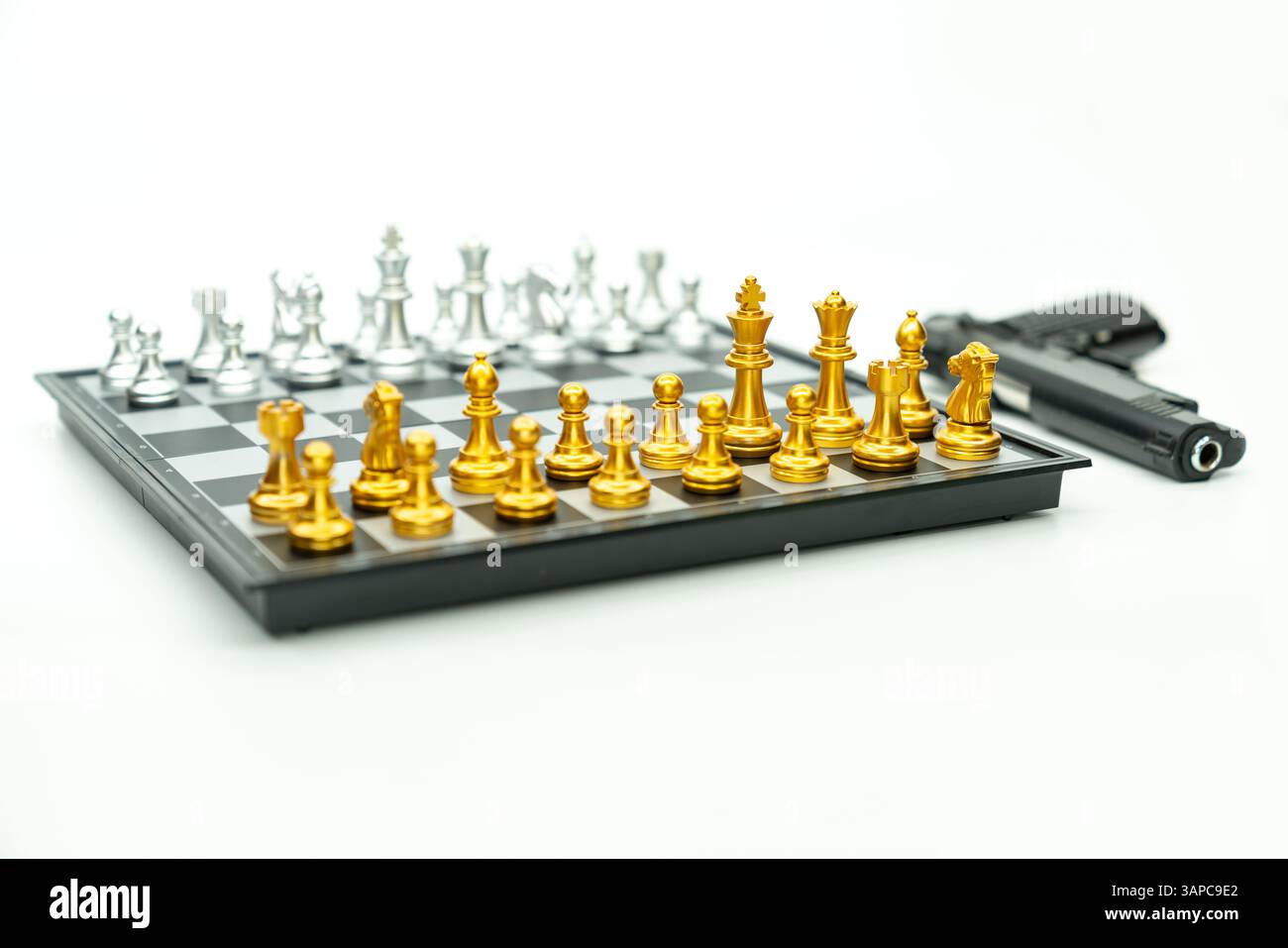Chess on board and gun concept of business force on white background ...