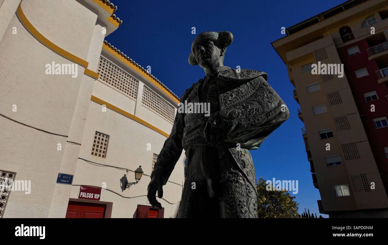 Low angle view of a bullfighter statue with traditional costume ...