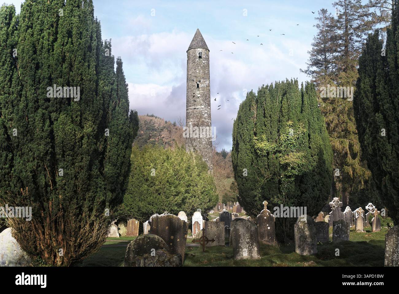 The Round Tower and ancient cemetery at Glendalough, a 6th-century ...