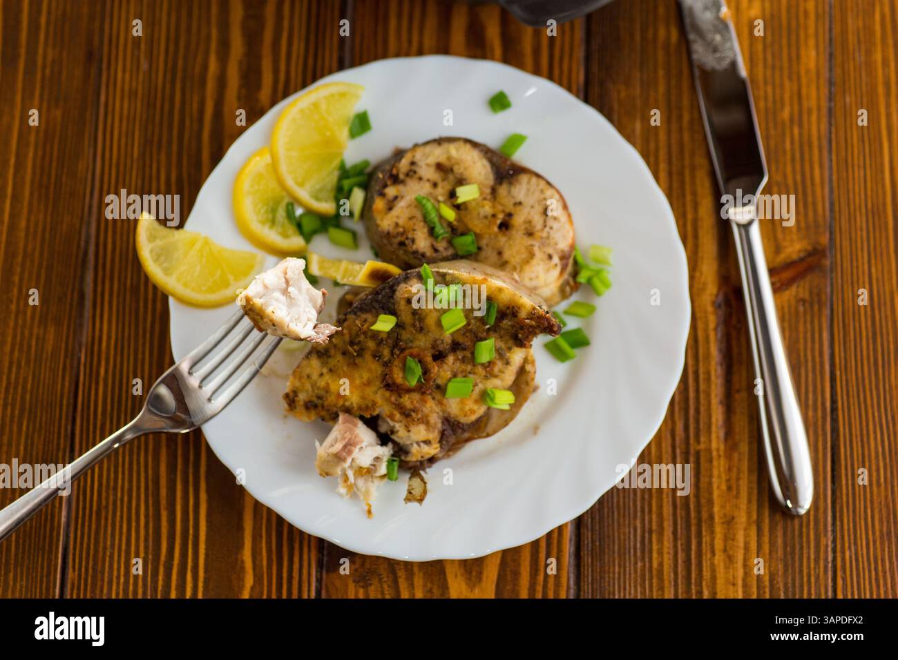Slicing lemon fish hi-res stock photography and images - Alamy