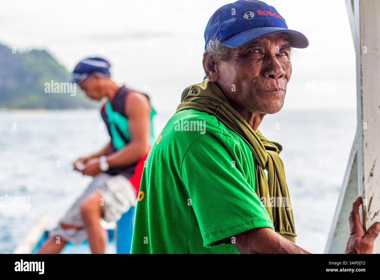 Local Filipino passengers sit inside a motorized boat as it travels ...