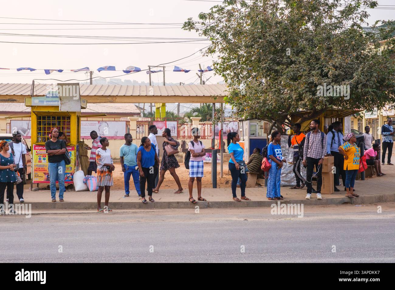 Accra, Ghana. Street Scene: Ghanaians Waiting for Shared Taxis or Buses ...