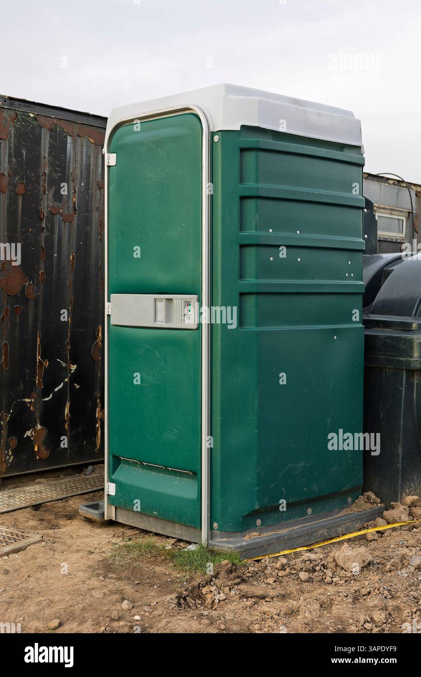 Green Portable Toilet, Black Diesel Oil Tank and Generator on Uneven ...